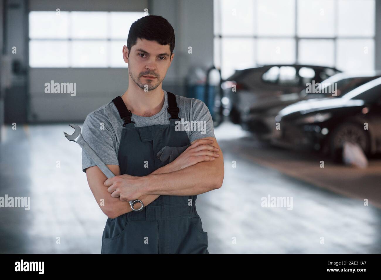 Our best employee. Portrait of serious worker in uniform that stands in ...