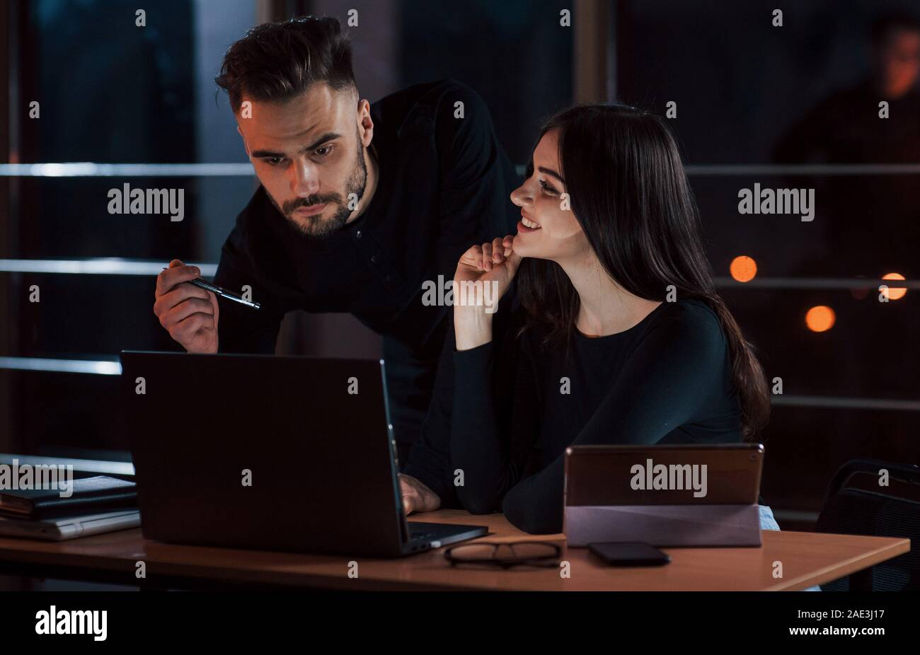 Guy with stylish haircut. Team of young business people works on their ...