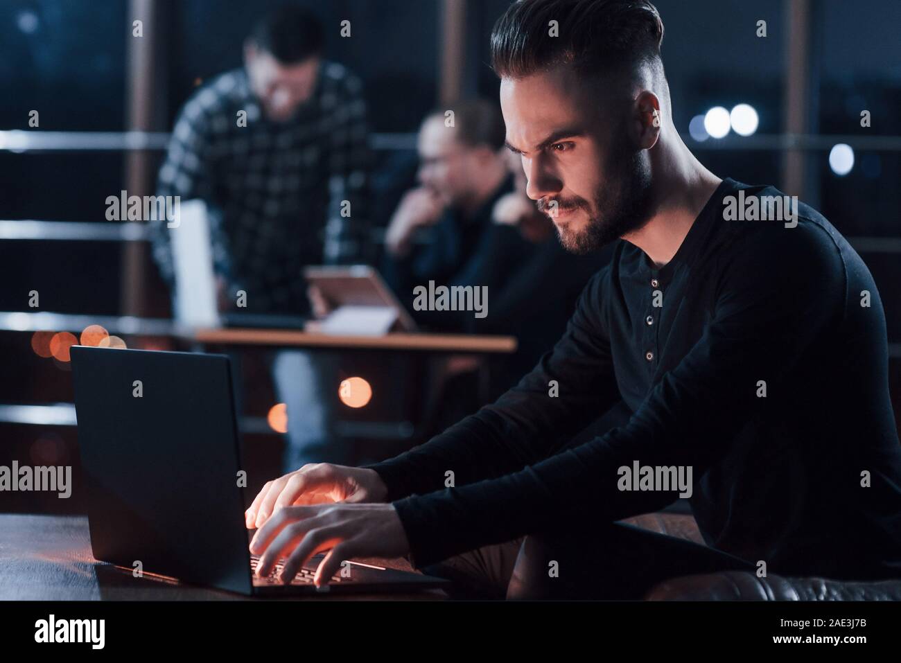 In front of employees. Team of young business people works on their ...