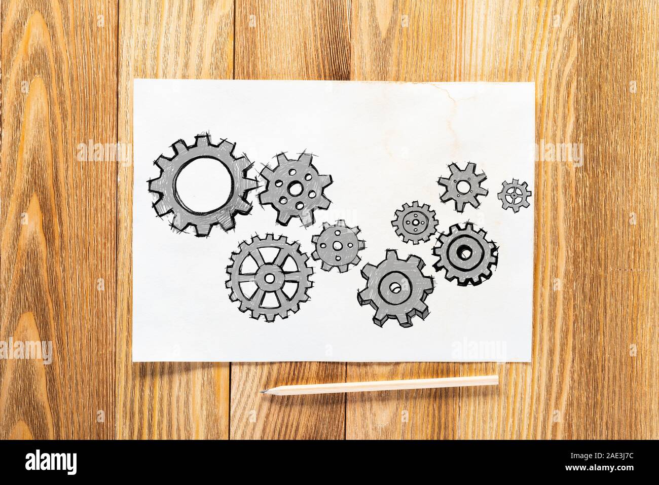Group of rotating gears pencil hand drawn Stock Photo - Alamy