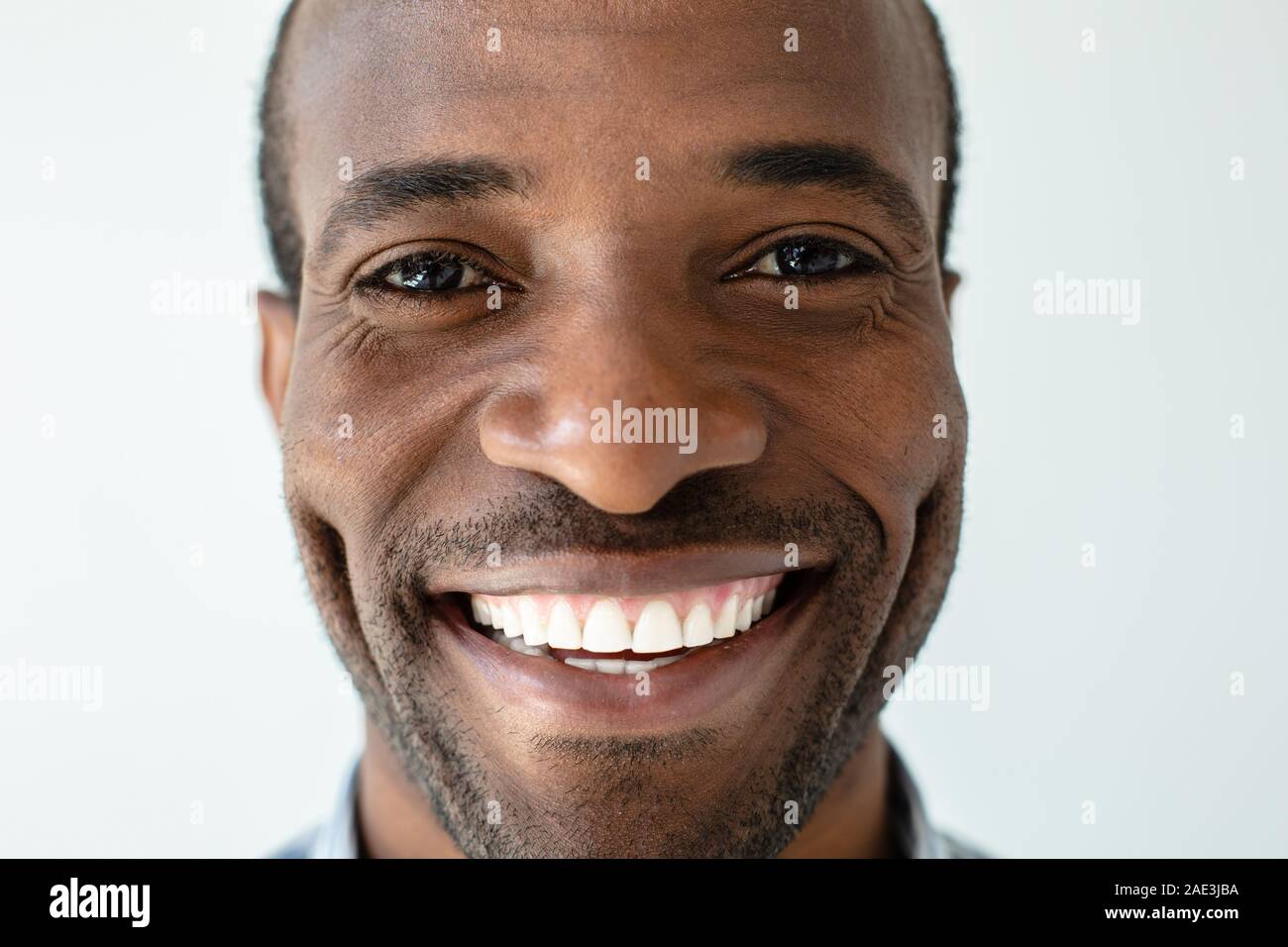 Portrait of optimistic afro american man smiling Stock Photo - Alamy
