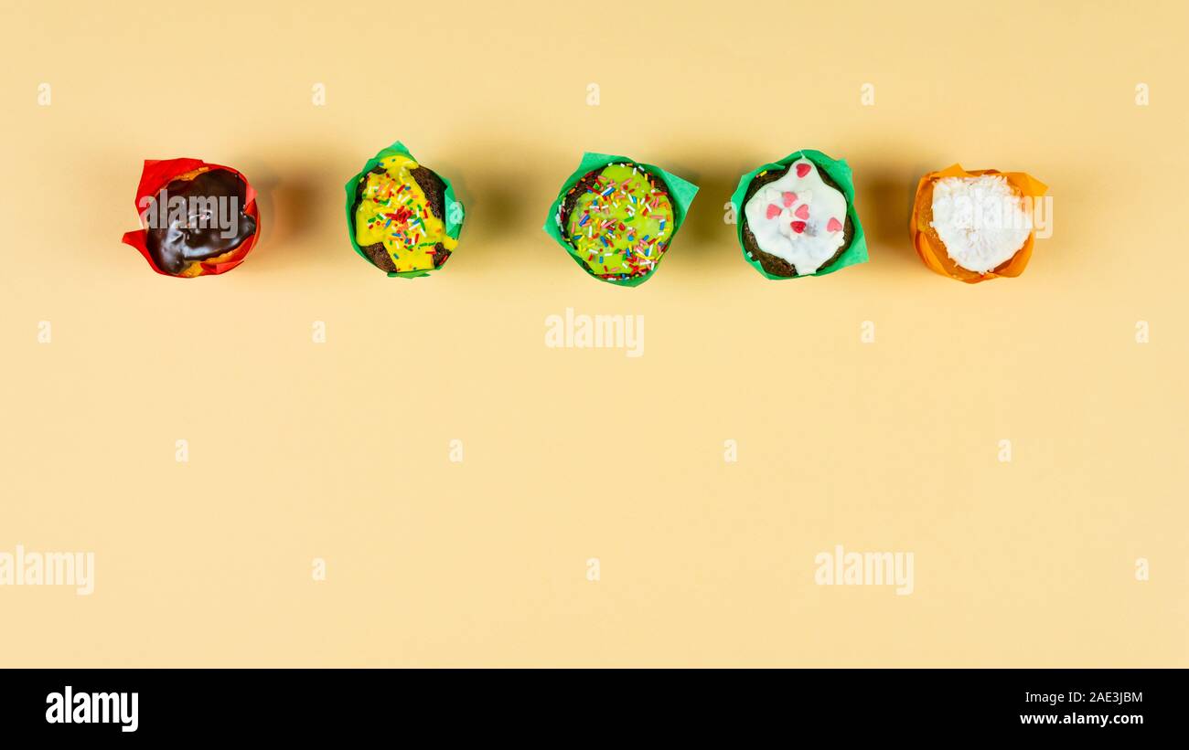 Colorful muffin dancing on yellow background. Concept of bakery ...