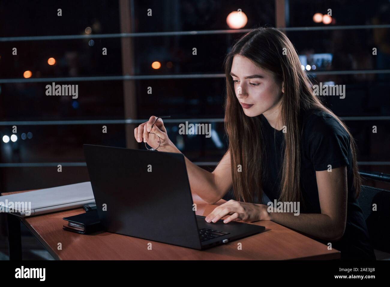 Many of the work she have. Attractive brunette businesswoman works ...