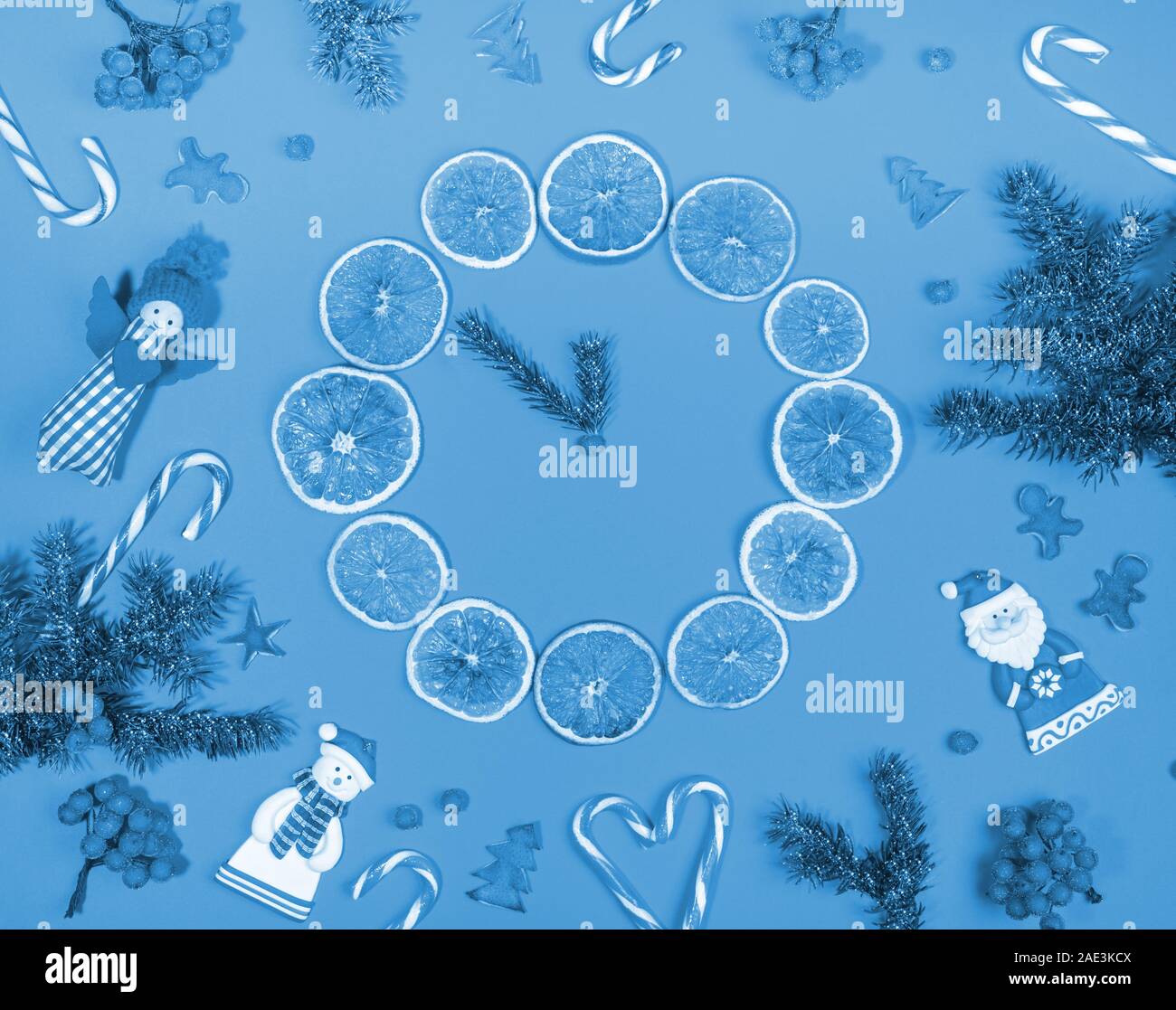 Christmas layout with creative dial of clock of dried orange slices ...