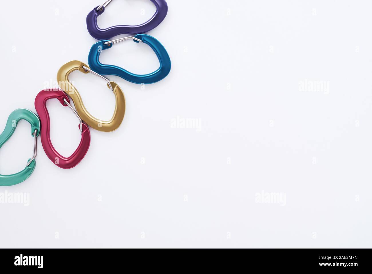 Climbing sports outdoor. Many of the multi colored carabiners on lying ...