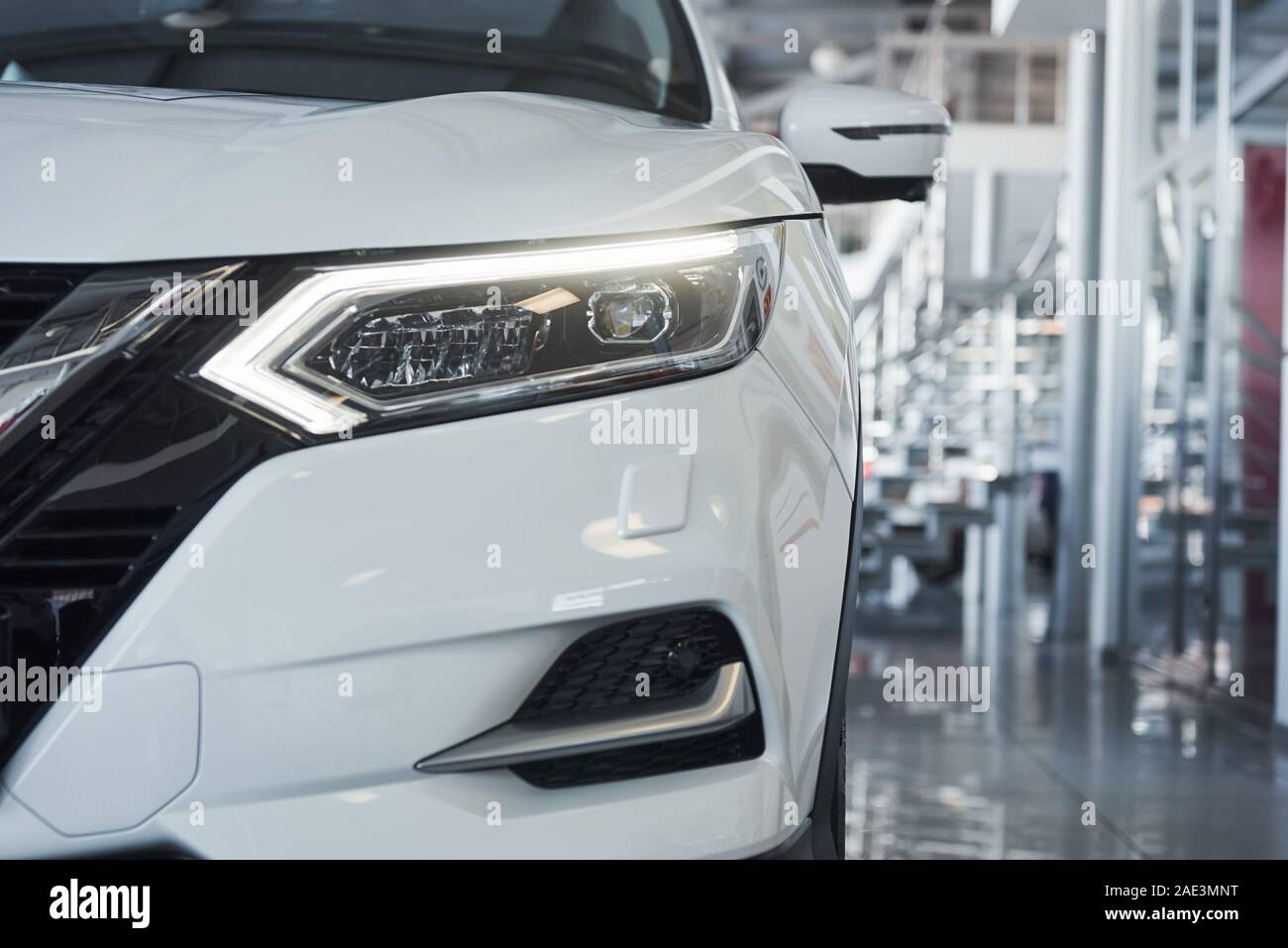 Modern brand new white car in the saloon. Ready for the sale. Perfectly ...