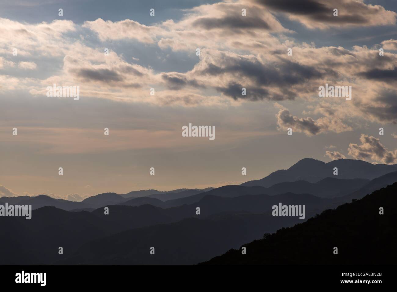dramatic sunset view of fading mountains in the background in the ...