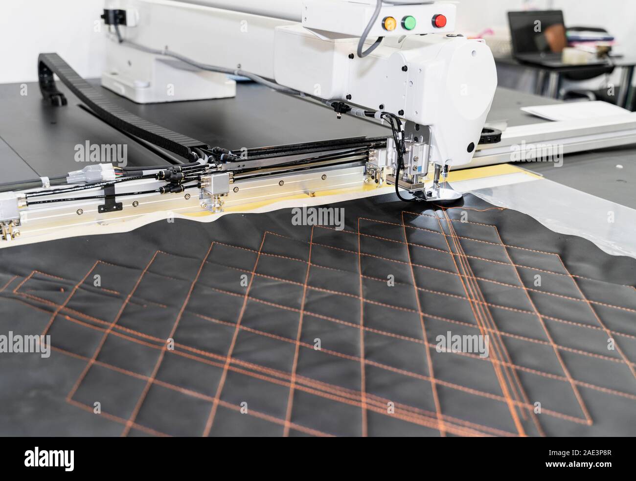 Programmable sewing machine embroider a pattern on a fabric. Innovative ...