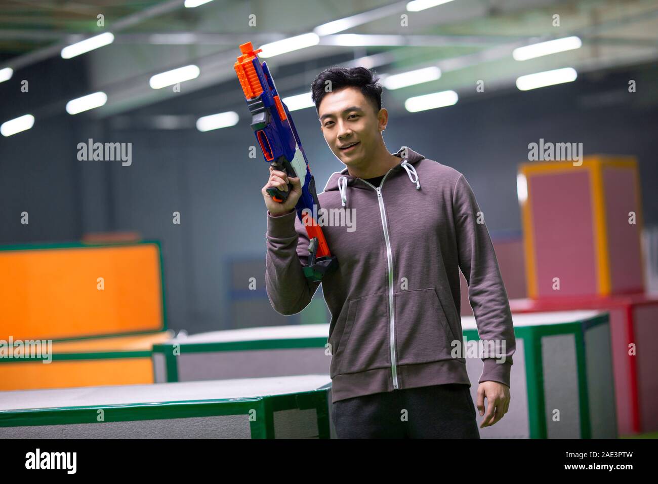 Young man playing fighting games hi-res stock photography and images ...