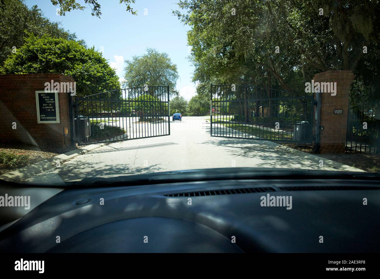 automatic gates opening driving out of a gated community florida usa ...