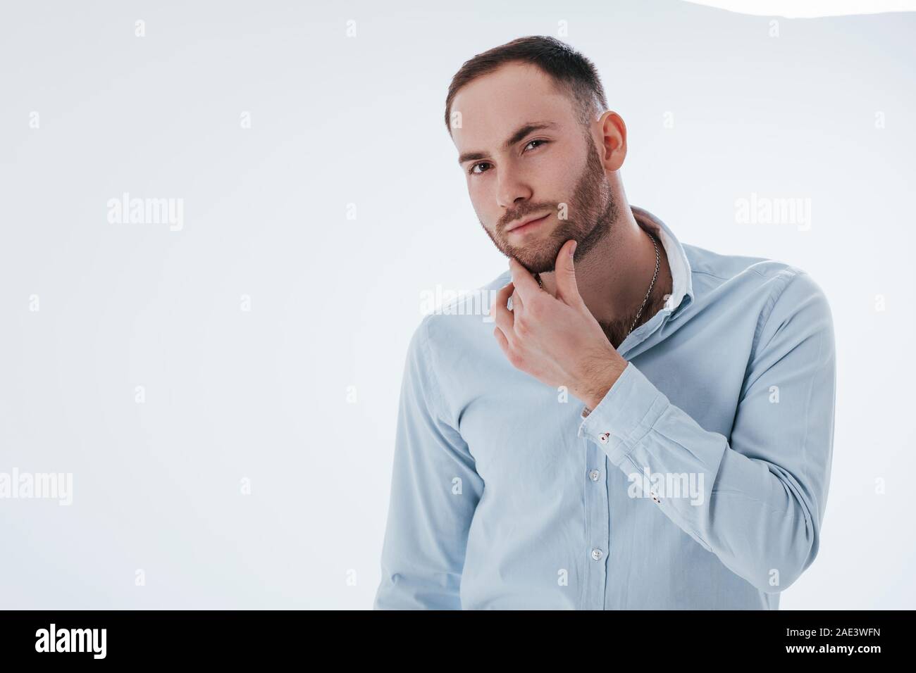 Ready to work. Man in official clothes stands against white background ...