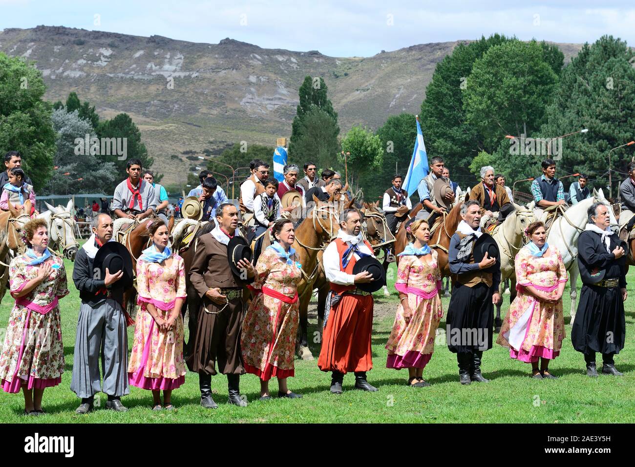 Dance group and riders sing the national anthem at the opening ceremony ...