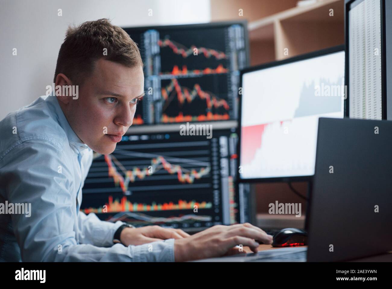 Laptop for daily job. Man working online in the office with multiple ...