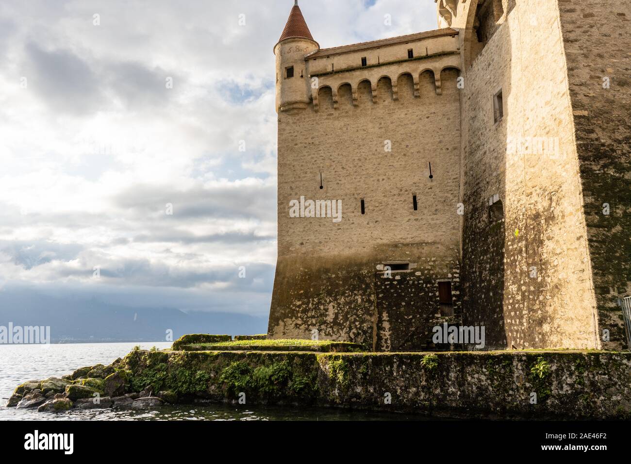 Pictures of a castle front a switzerland lake Stock Photo - Alamy