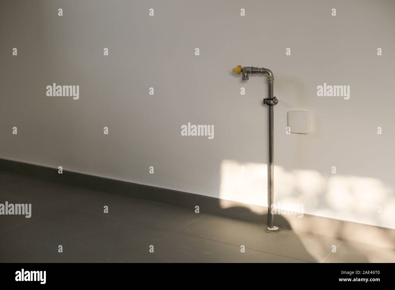 Natural Gas pipes on white wall in house kitchen Stock Photo - Alamy