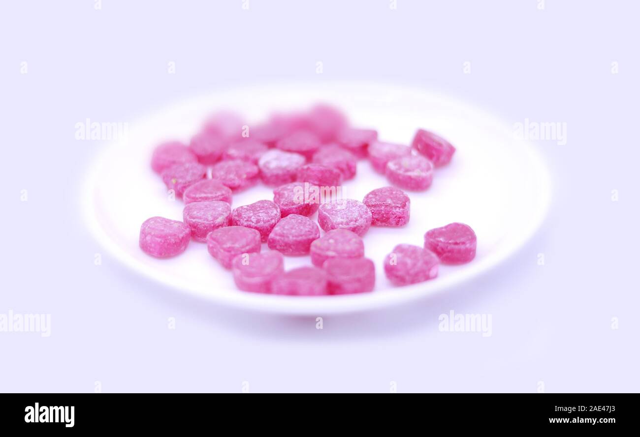 Bright colored candy sweets on a white background Stock Photo - Alamy