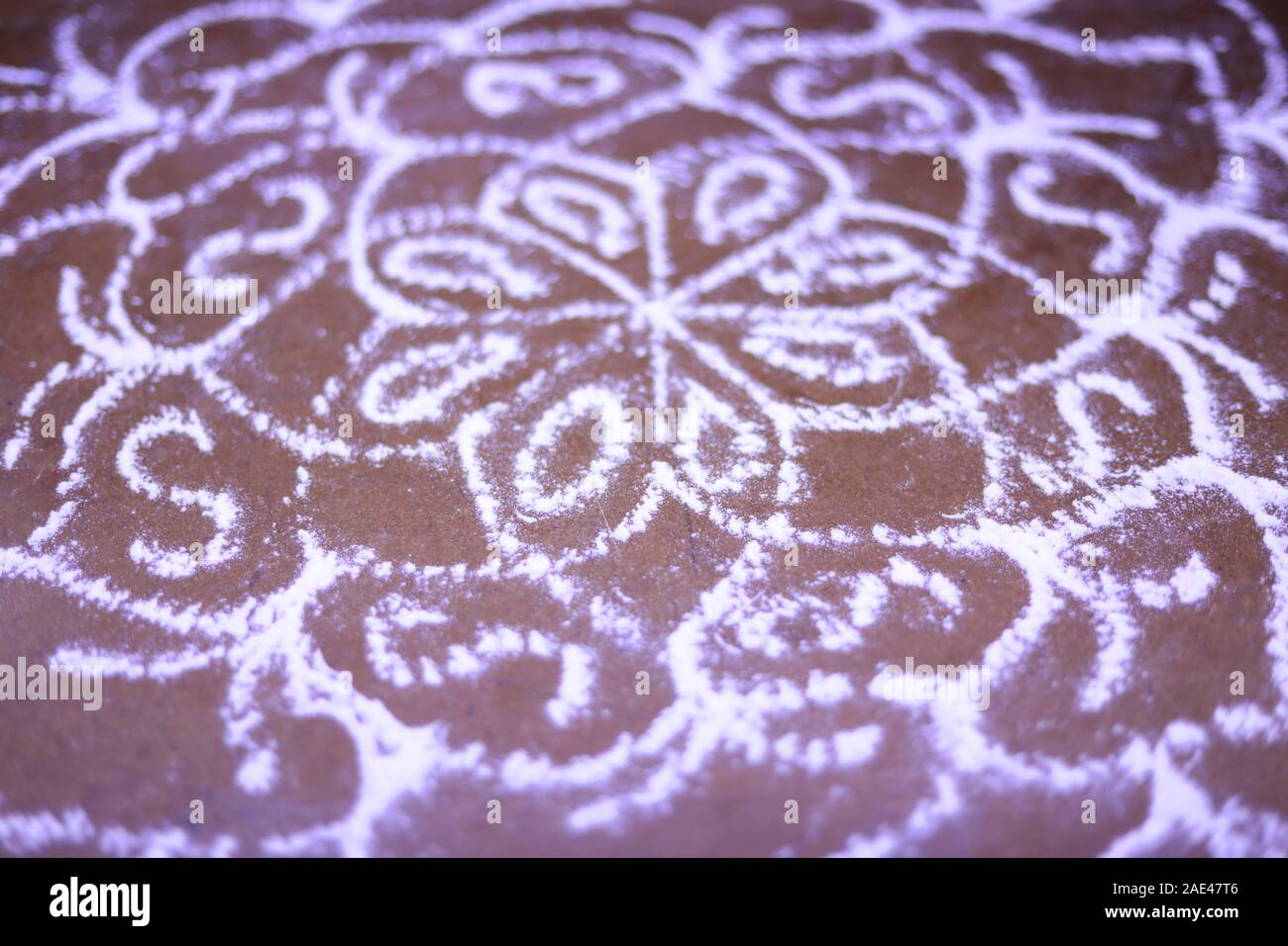 Indian traditional kolam (known in tamil language) or rangoli is drawn ...