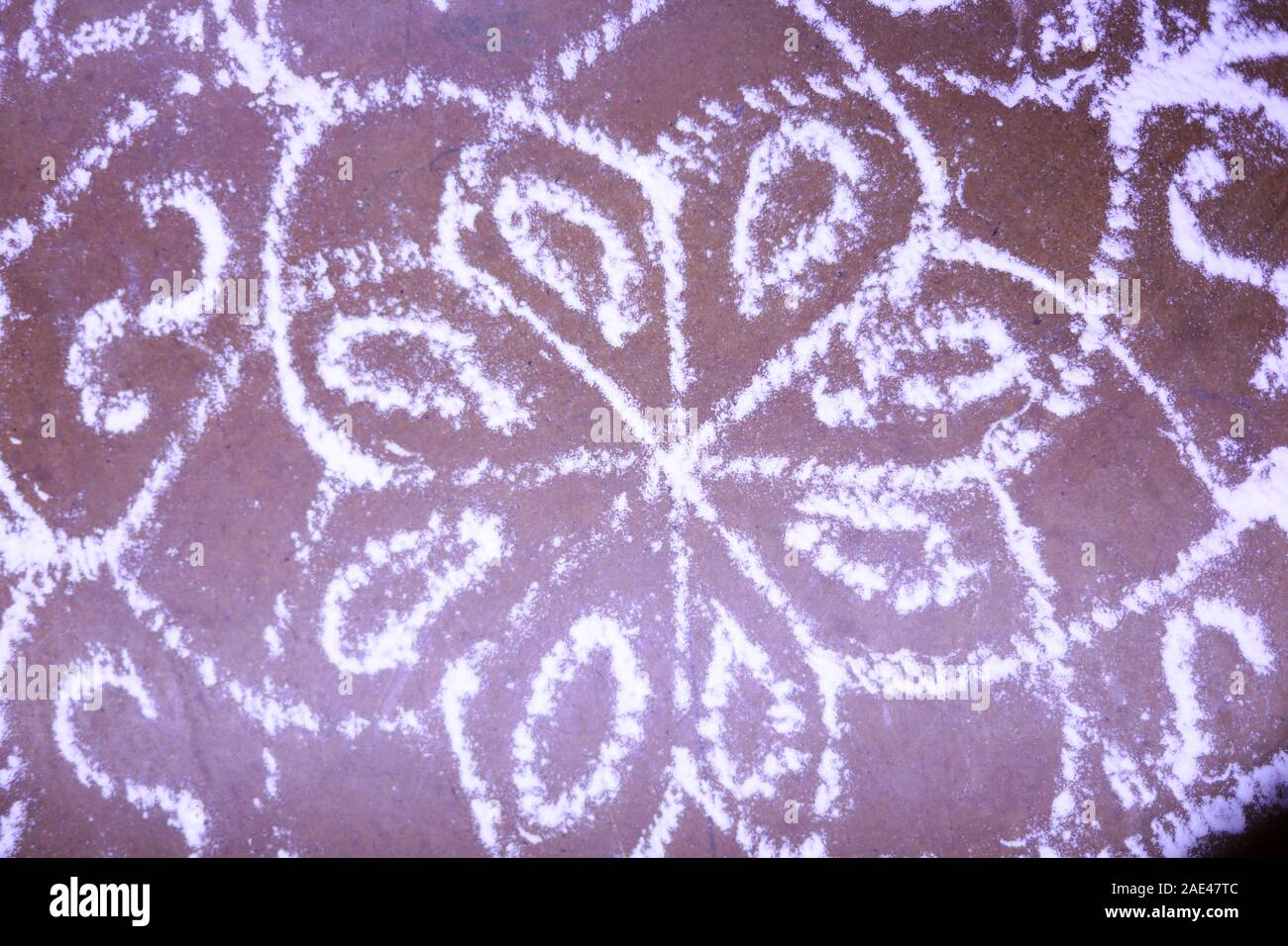 Indian traditional kolam (known in tamil language) or rangoli is drawn ...