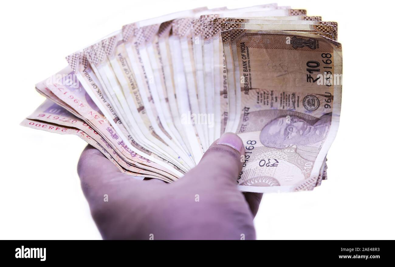 Hand with Indian ten rupee notes, white backgrounds Stock Photo - Alamy