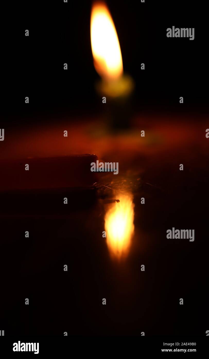 Candle light in the dark room with mirror effect Stock Photo - Alamy
