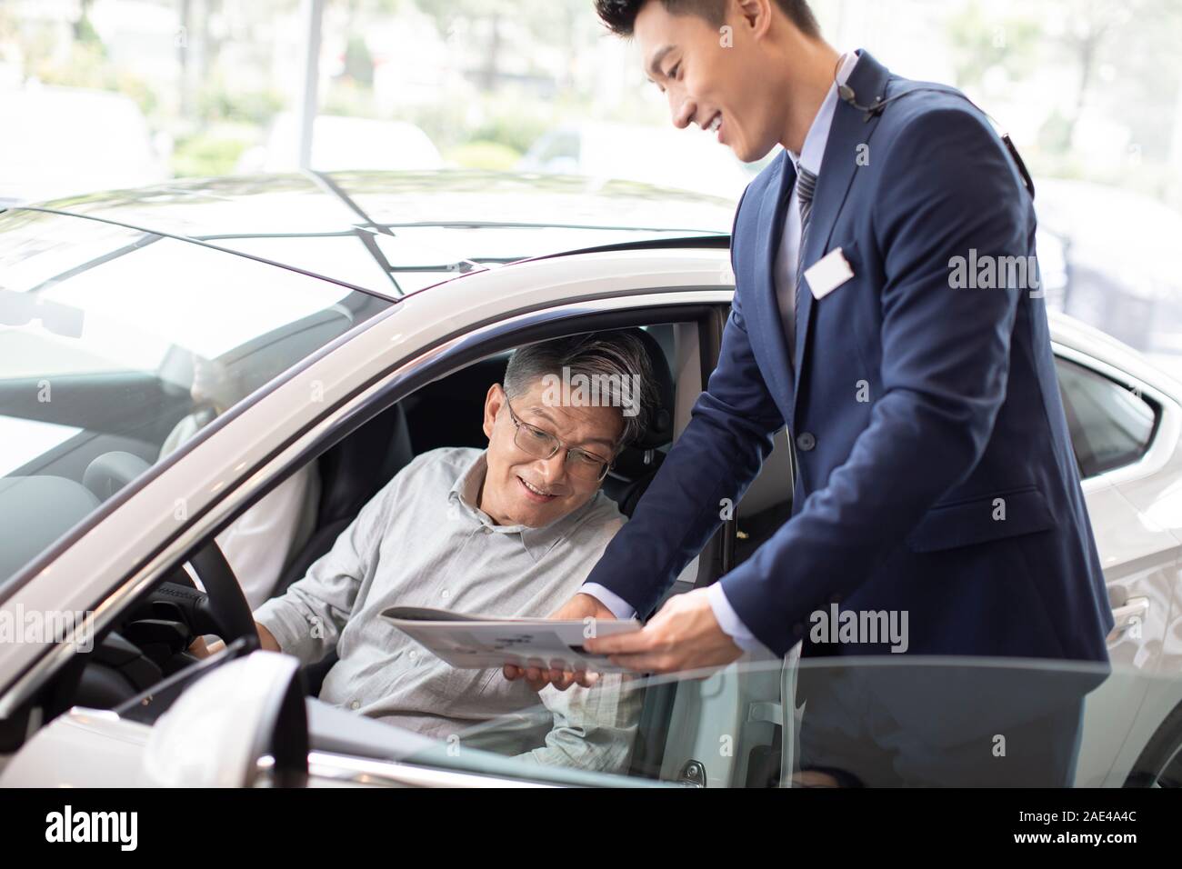 Asian couple driving new hi-res stock photography and images - Alamy