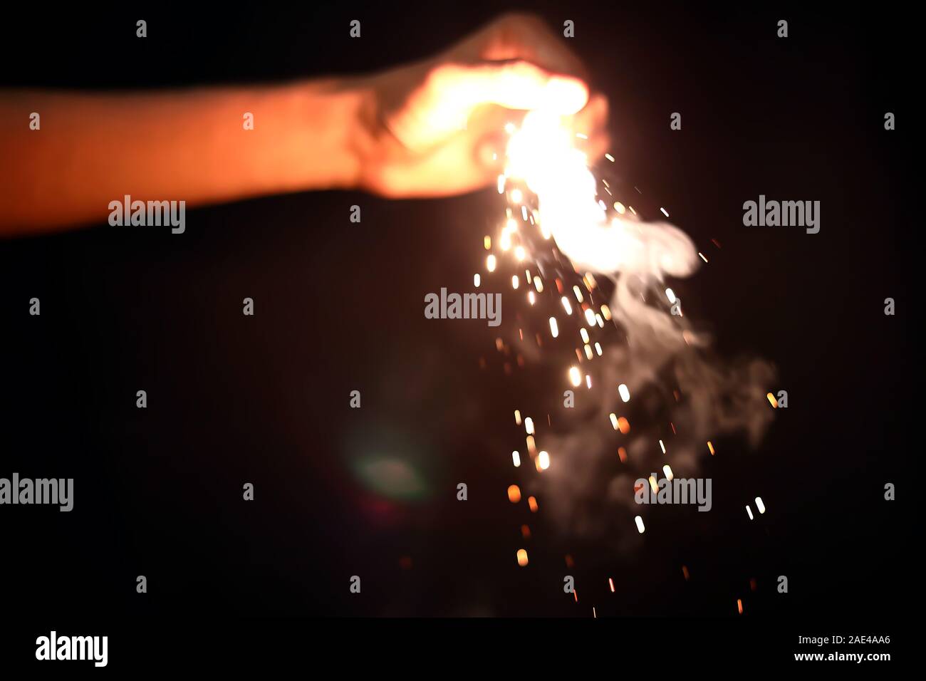 hand holding a burning sparklers Stock Photo - Alamy