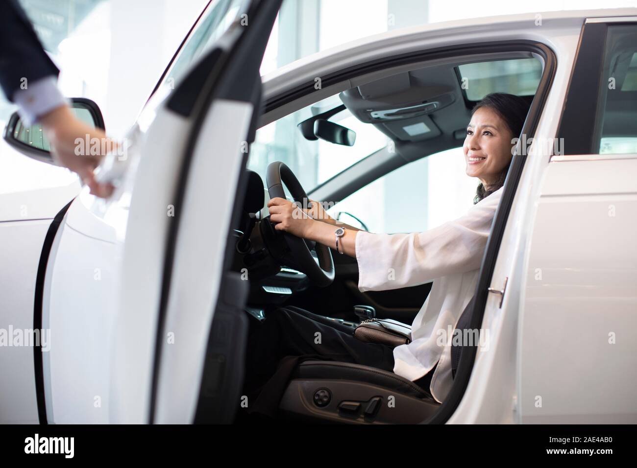 Mature woman test drive car hi-res stock photography and images - Alamy