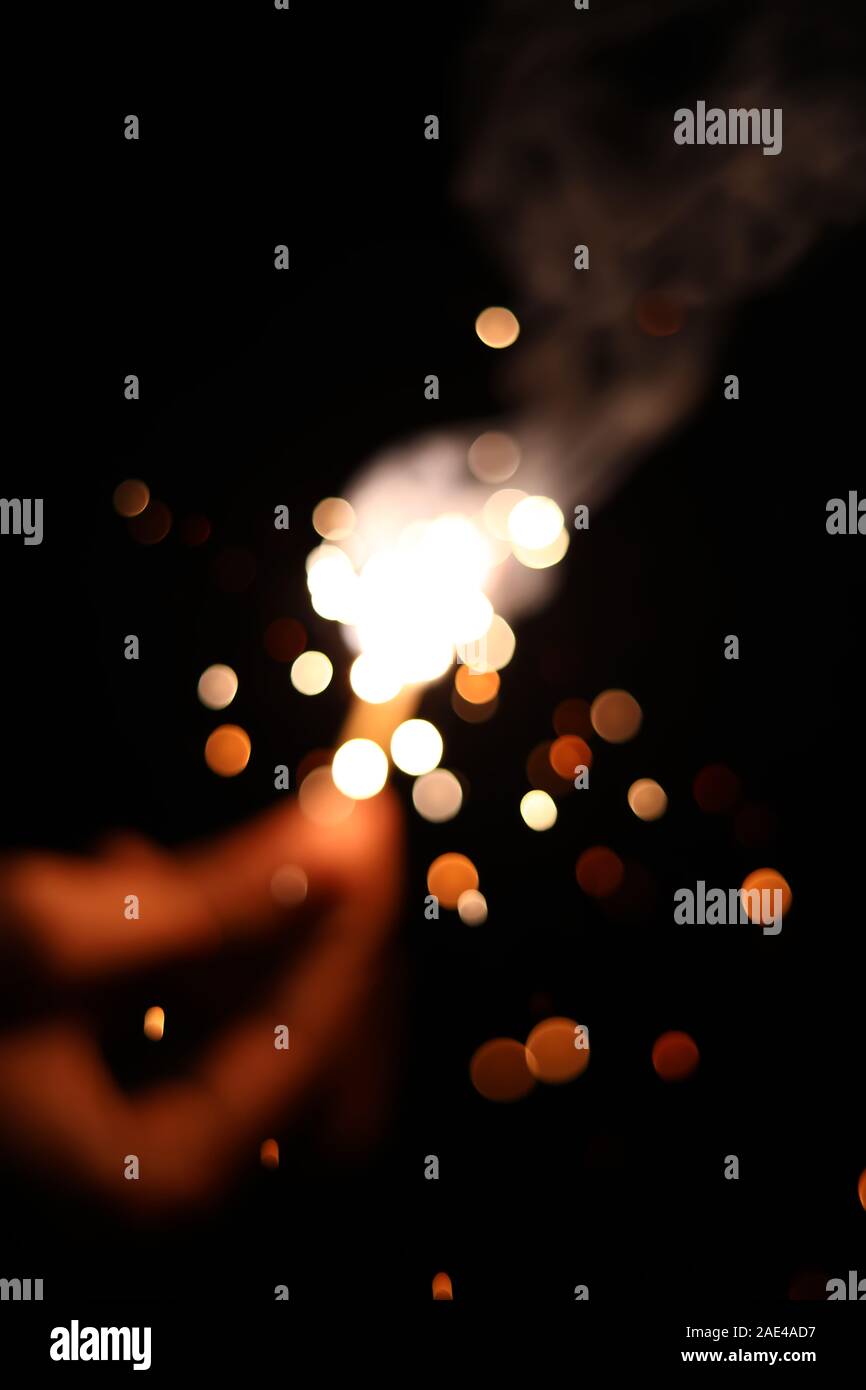 hand holding a burning sparklers Stock Photo - Alamy