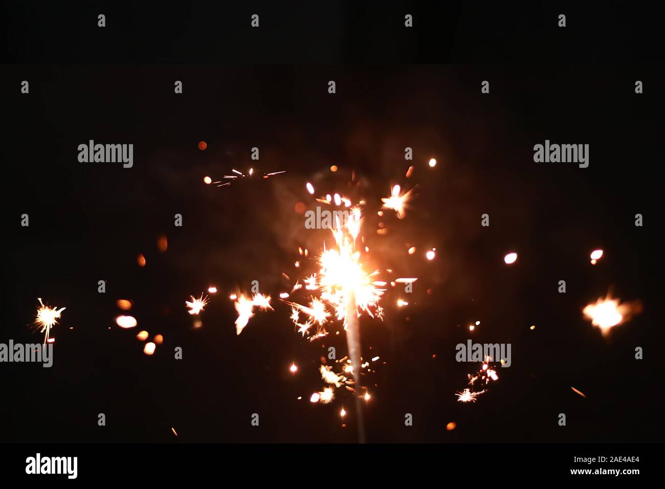 Hand Holding Burning Sparkler Blast On A Black Backgrounds Stock Photo ...
