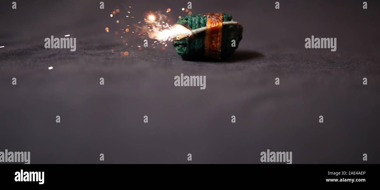 Diwali fire bomb cracker on black backgrounds Stock Photo - Alamy