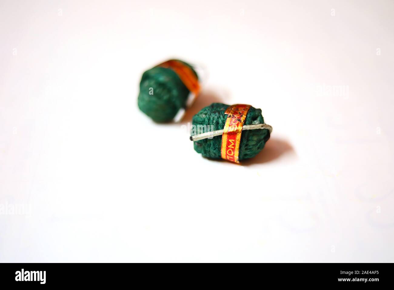 Diwali fire bomb cracker on white backgrounds Stock Photo - Alamy