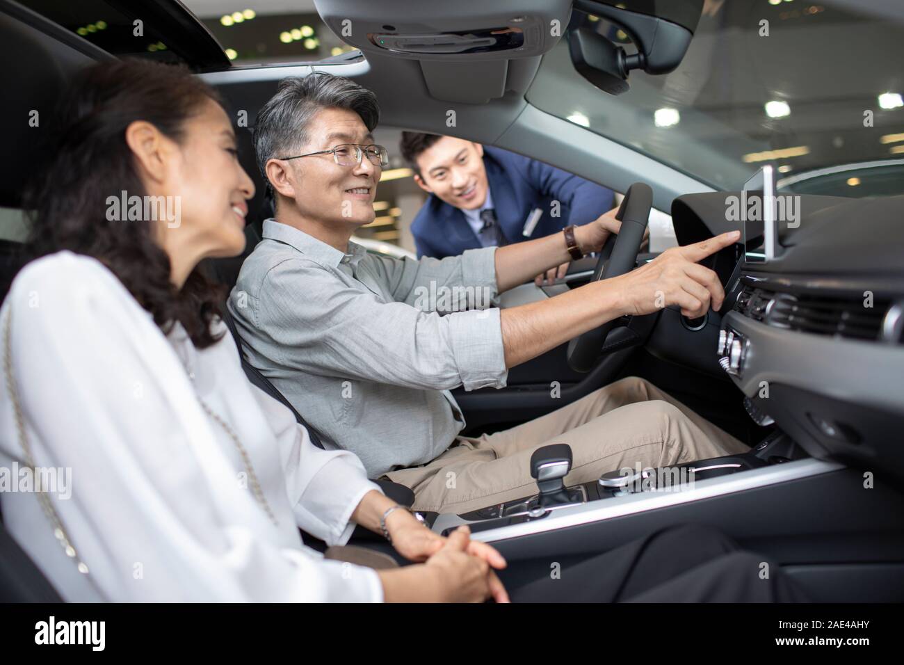 Asian couple driving new hi-res stock photography and images - Alamy