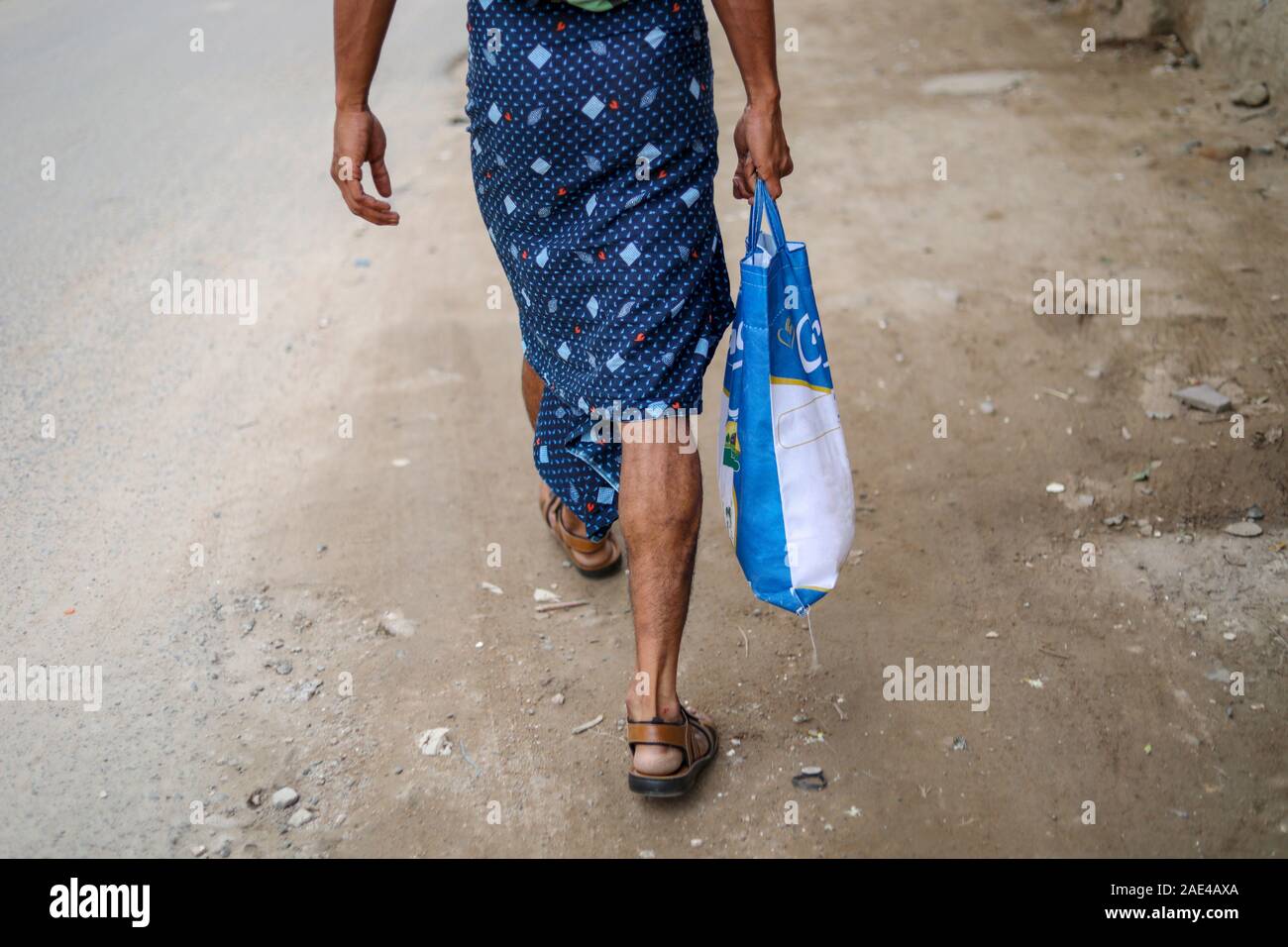 Happy beautiful young man walking in street Stock Photo - Alamy