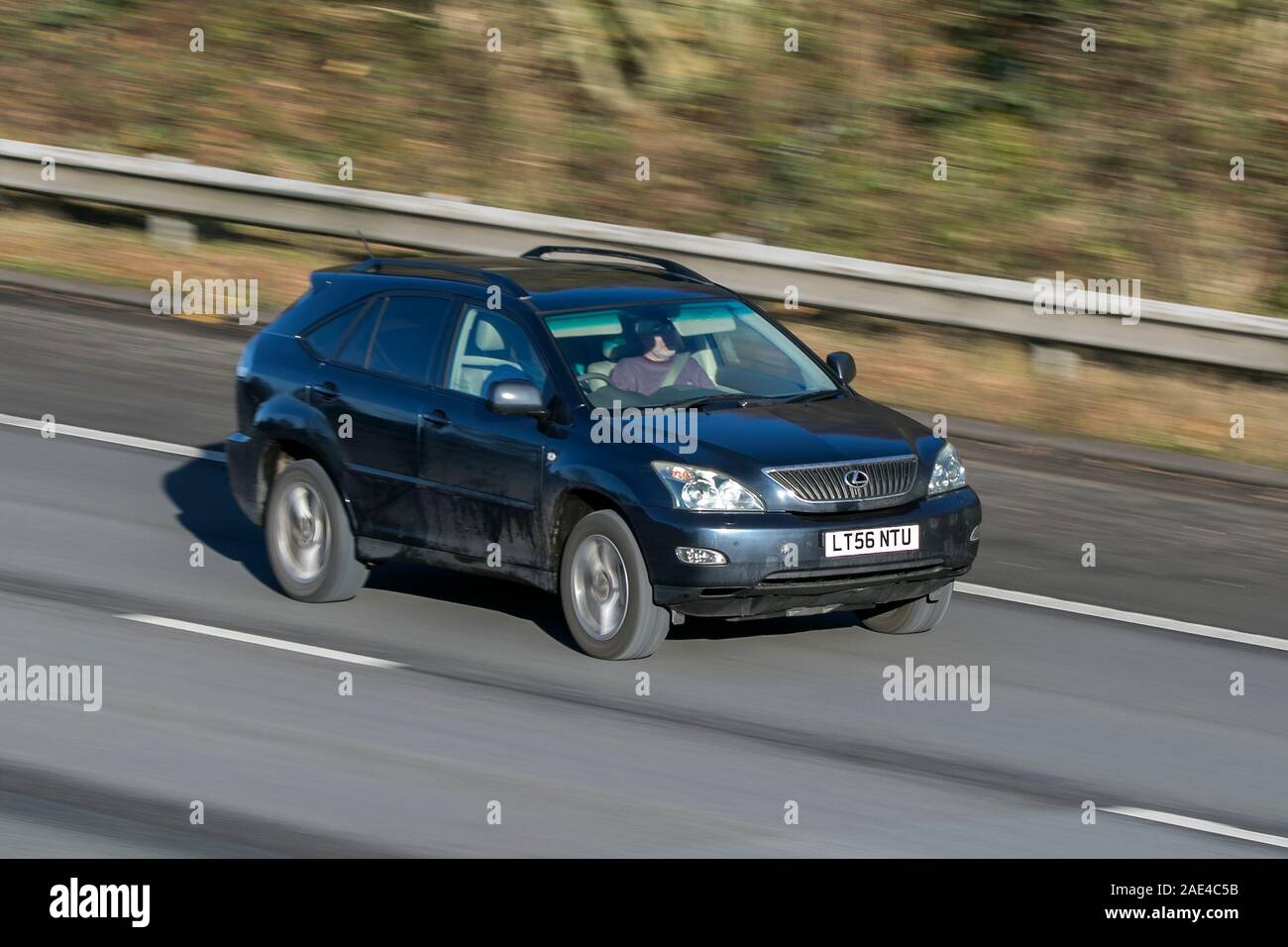 Blurred moving car LEXUS Rx350 Se Auto traveling at speed on the M61 ...