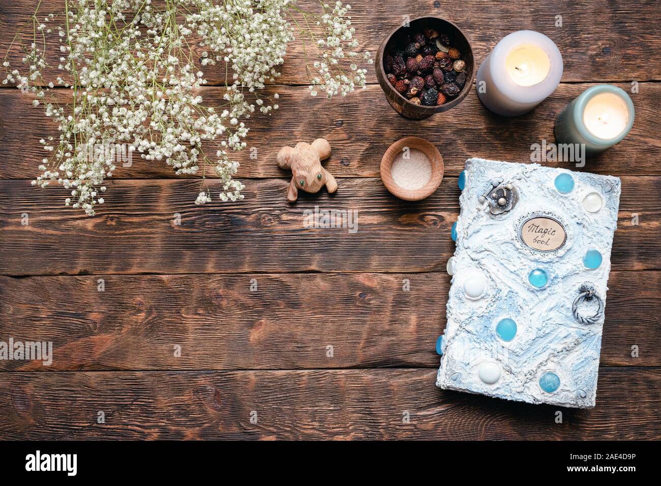 Witch doctor or shaman table flat lay background. Magic book on the ...
