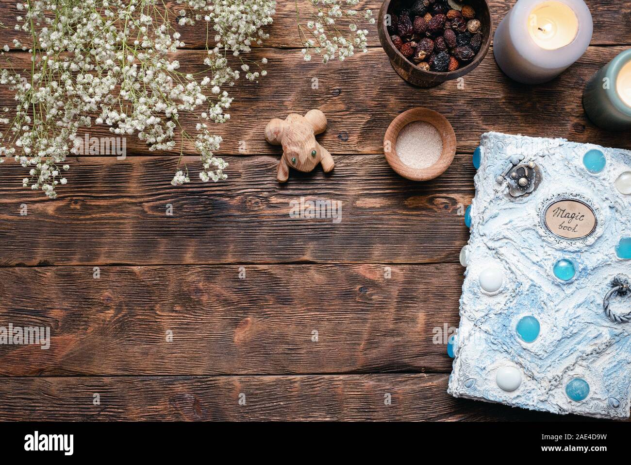 Witch doctor or shaman table flat lay background. Magic book on the ...