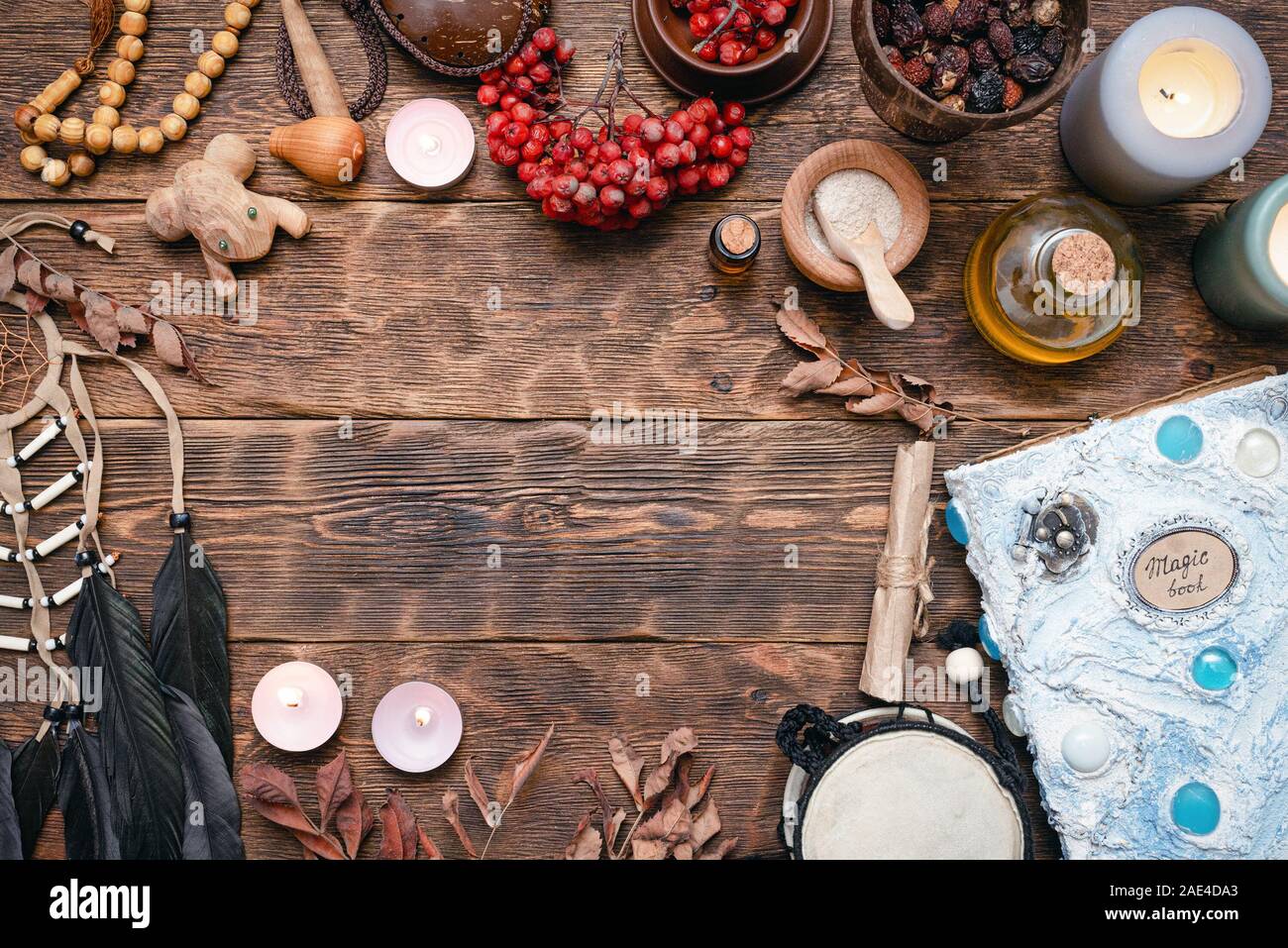 Witch doctor or shaman table flat lay background. Magic book on the ...