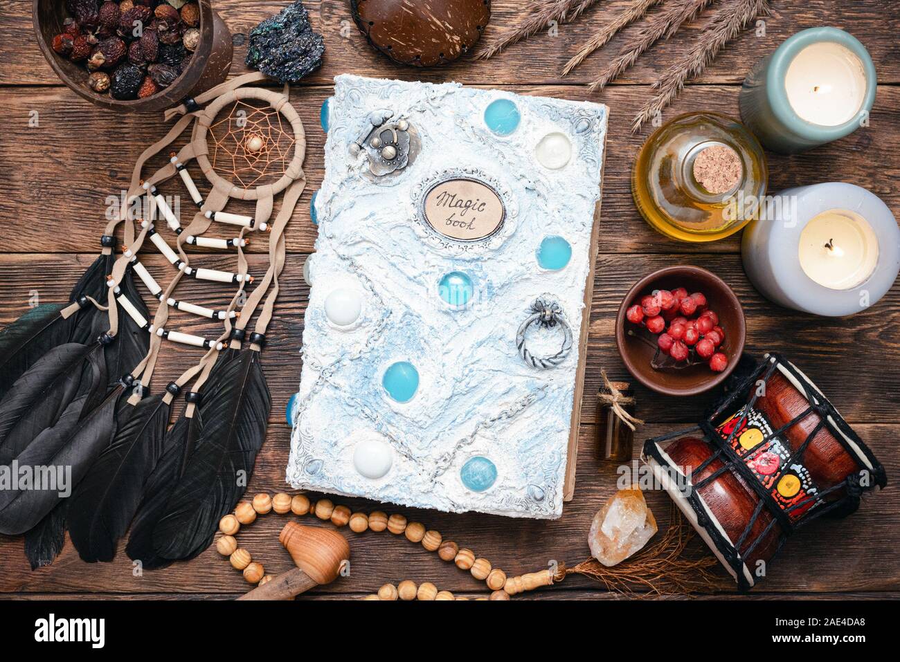 Witch doctor or shaman table flat lay background. Magic book on the ...