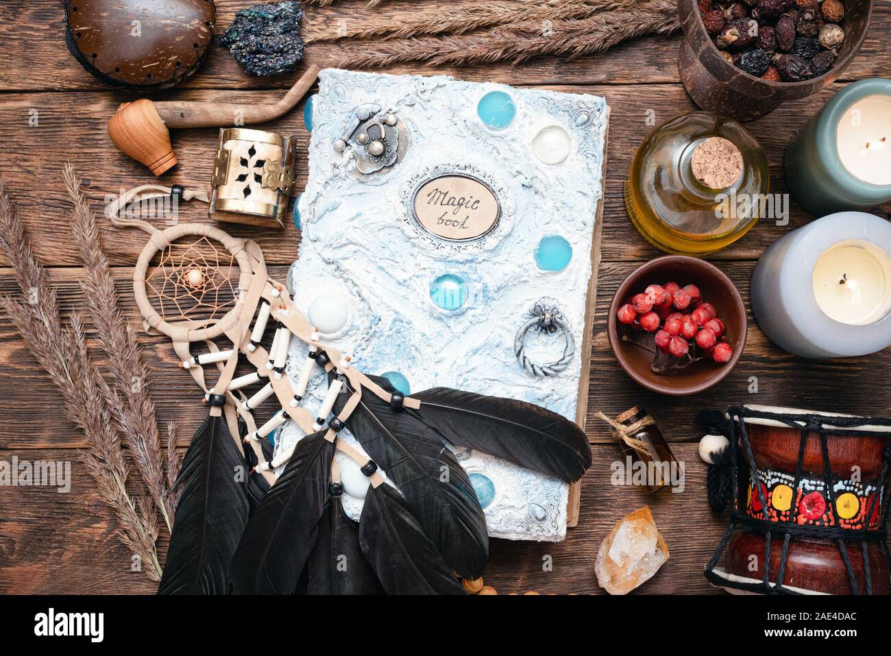 Witch doctor or shaman table flat lay background. Magic book on the ...