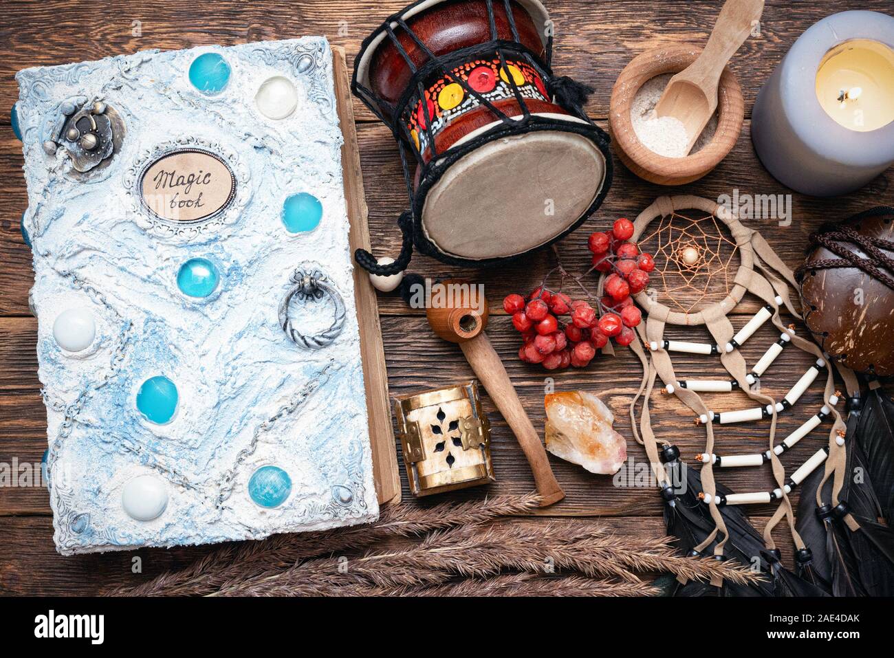 Witch doctor or shaman table flat lay background. Magic book on the ...