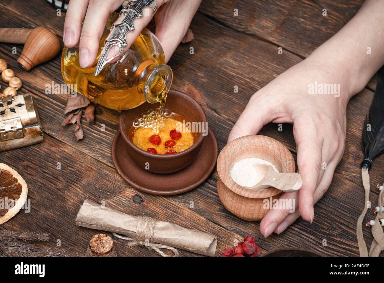Witch doctor is preparing a magic potion on her table Stock Photo - Alamy