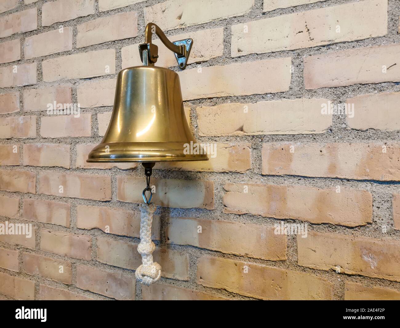 Collectable emergency brass bell and its rope Stock Photo - Alamy