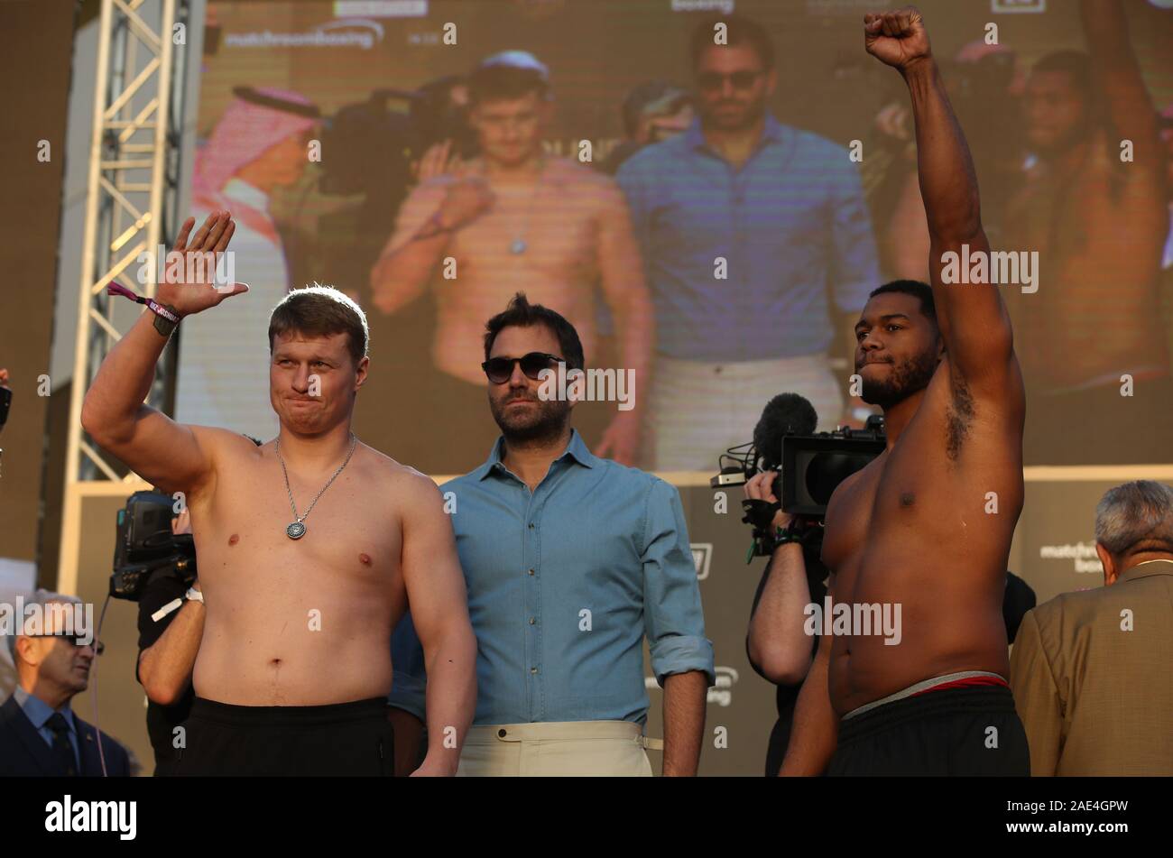 Alexander Povetkin (left), Promoter Eddie Hearn and Michael Hunter ...