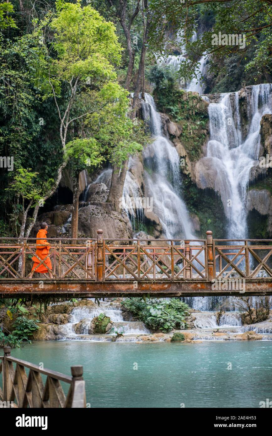 Monk on the bridge in the Kuang Si Waterfall, Laos, Asia Stock Photo ...