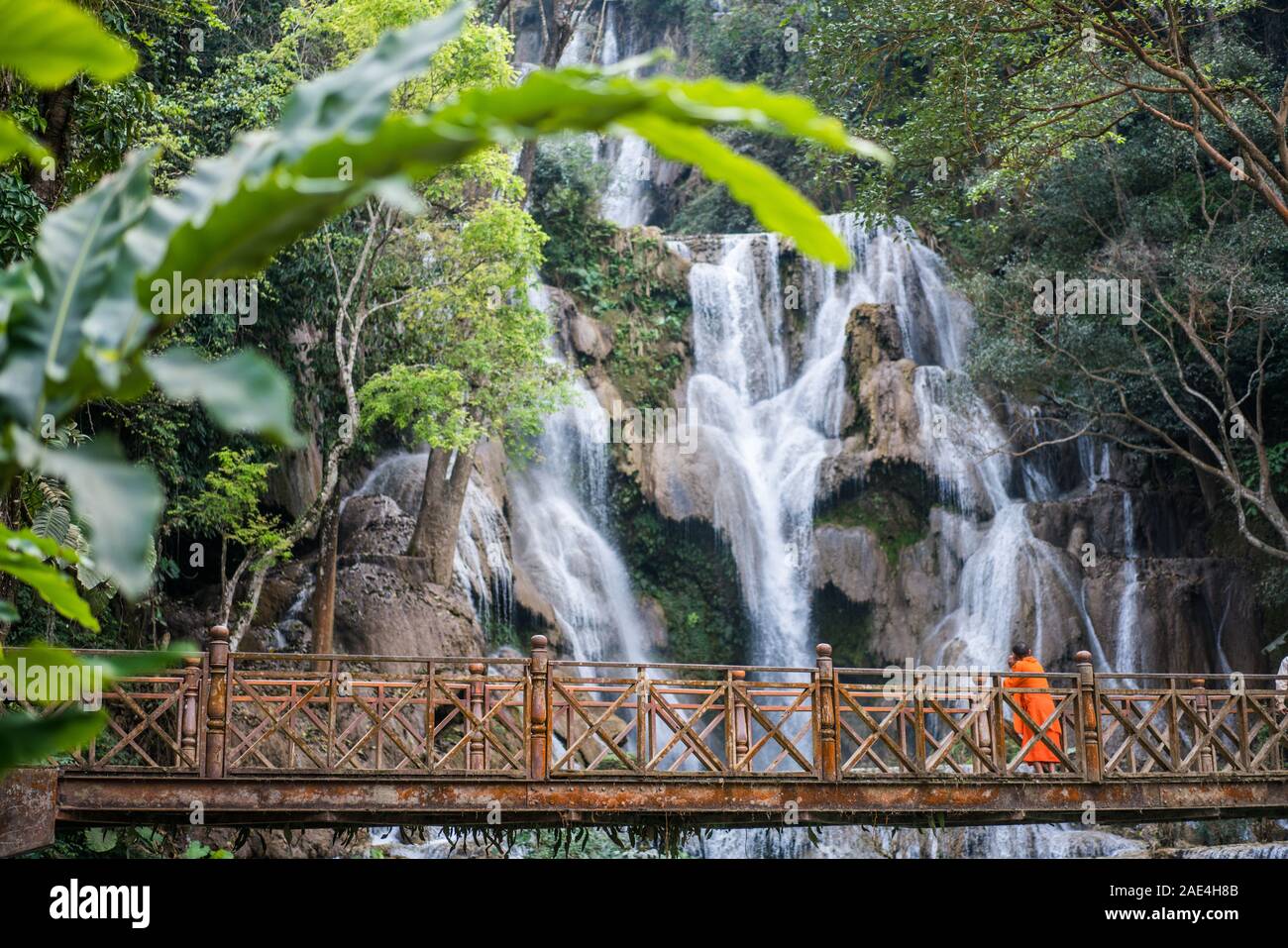 Monk on the bridge in the Kuang Si Waterfall, Laos, Asia Stock Photo ...