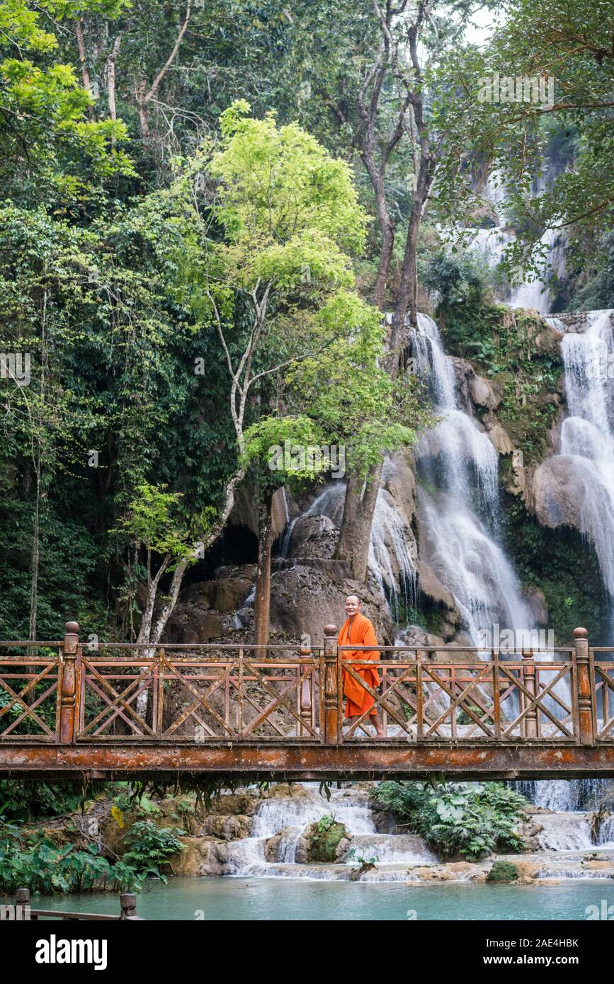 Monk on the bridge in the Kuang Si Waterfall, Laos, Asia Stock Photo ...