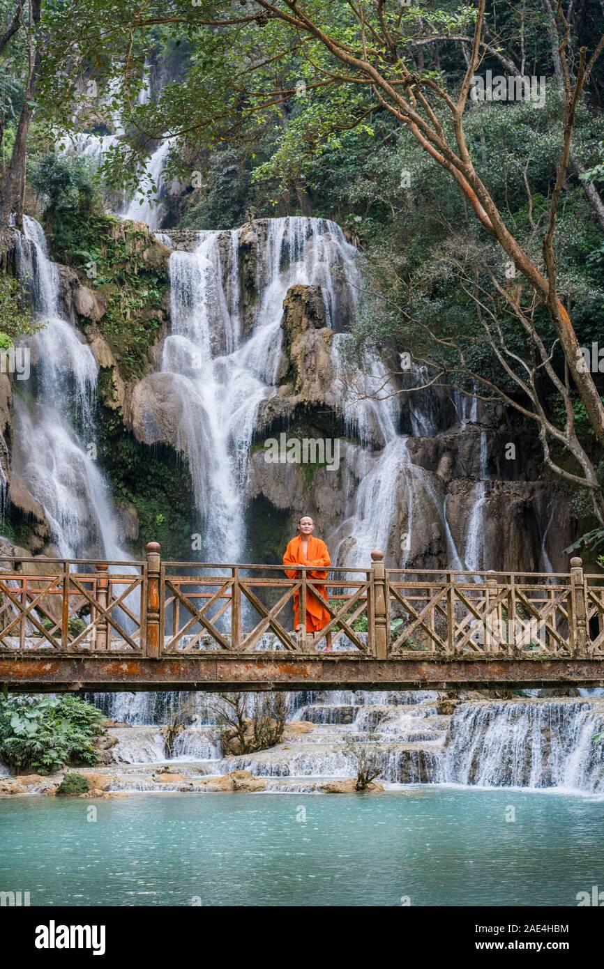 Monk on the bridge in the Kuang Si Waterfall, Laos, Asia Stock Photo ...