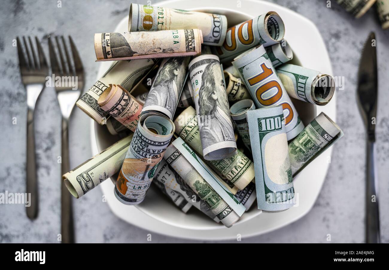 Cash banknotes of American dollar bills of various face values as a ...