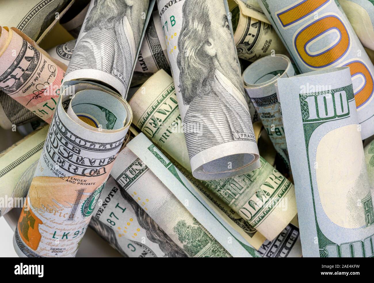 Cash banknotes of American dollar bills of various values stand on the ...