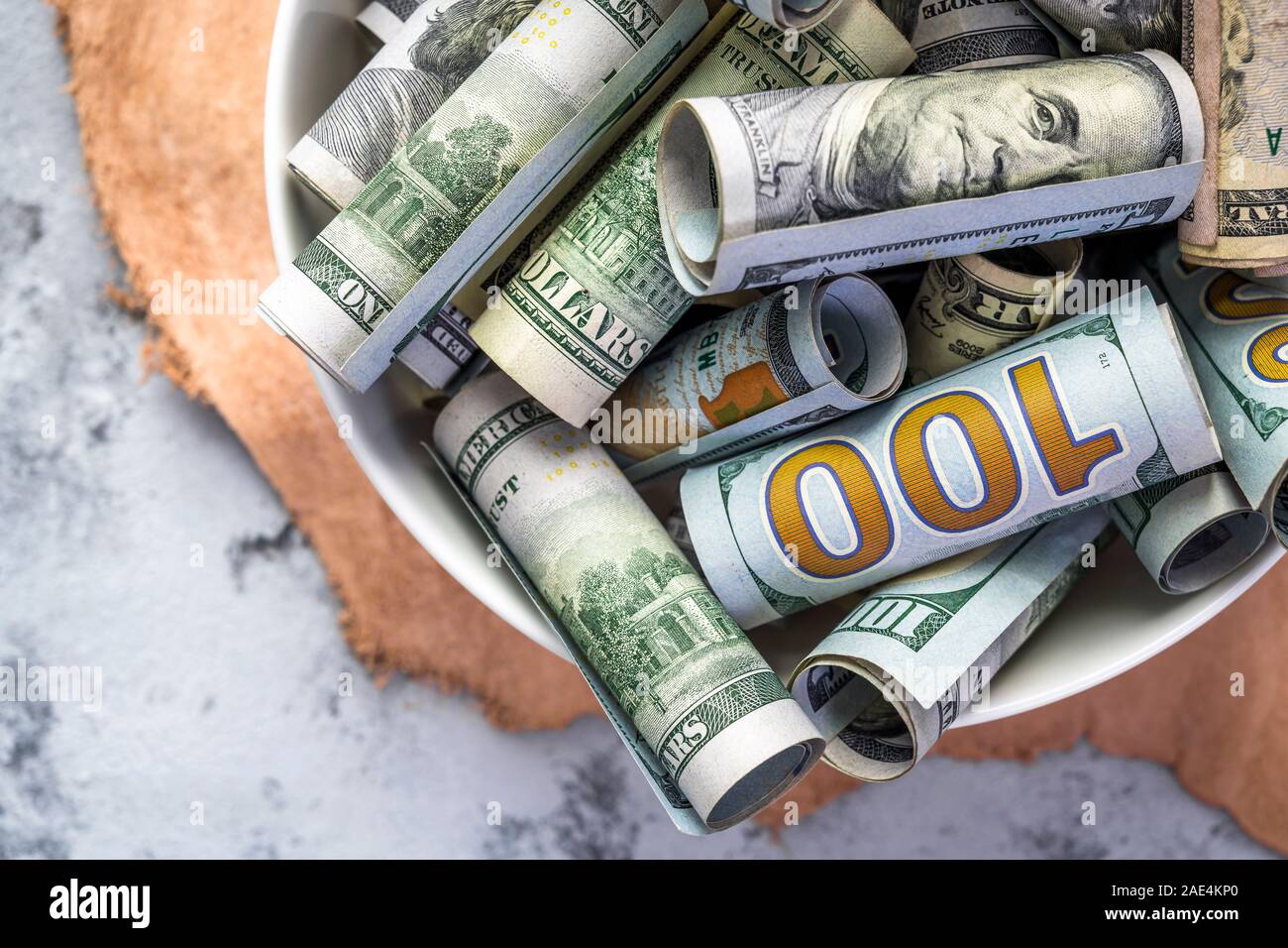 Cash banknotes of American dollar bills of various face values as a ...